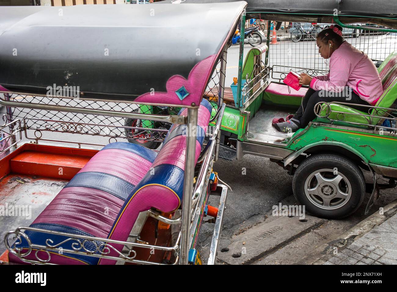 Woman,driver, waiting for customers, three wheel taxi Tuk Tuk, in Khao ...