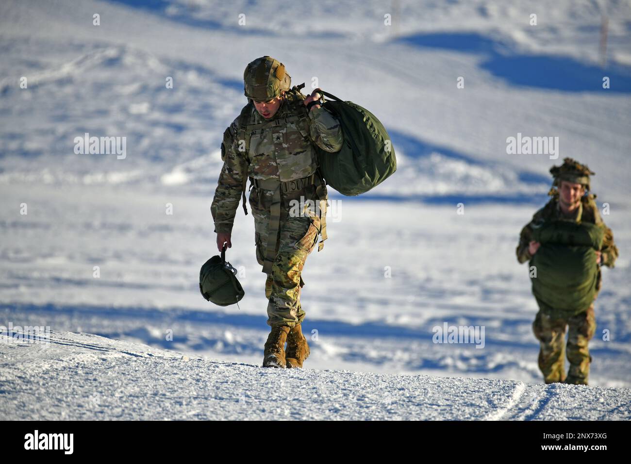 U.S. Army paratrooper assigned to the 173rd Airborne Brigade, walk in ...