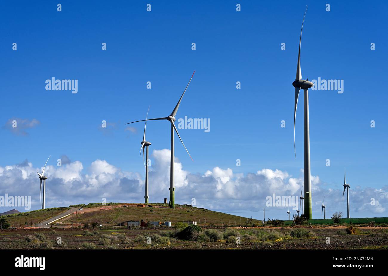 Field and hill with multiple wind turbines Stock Photo - Alamy