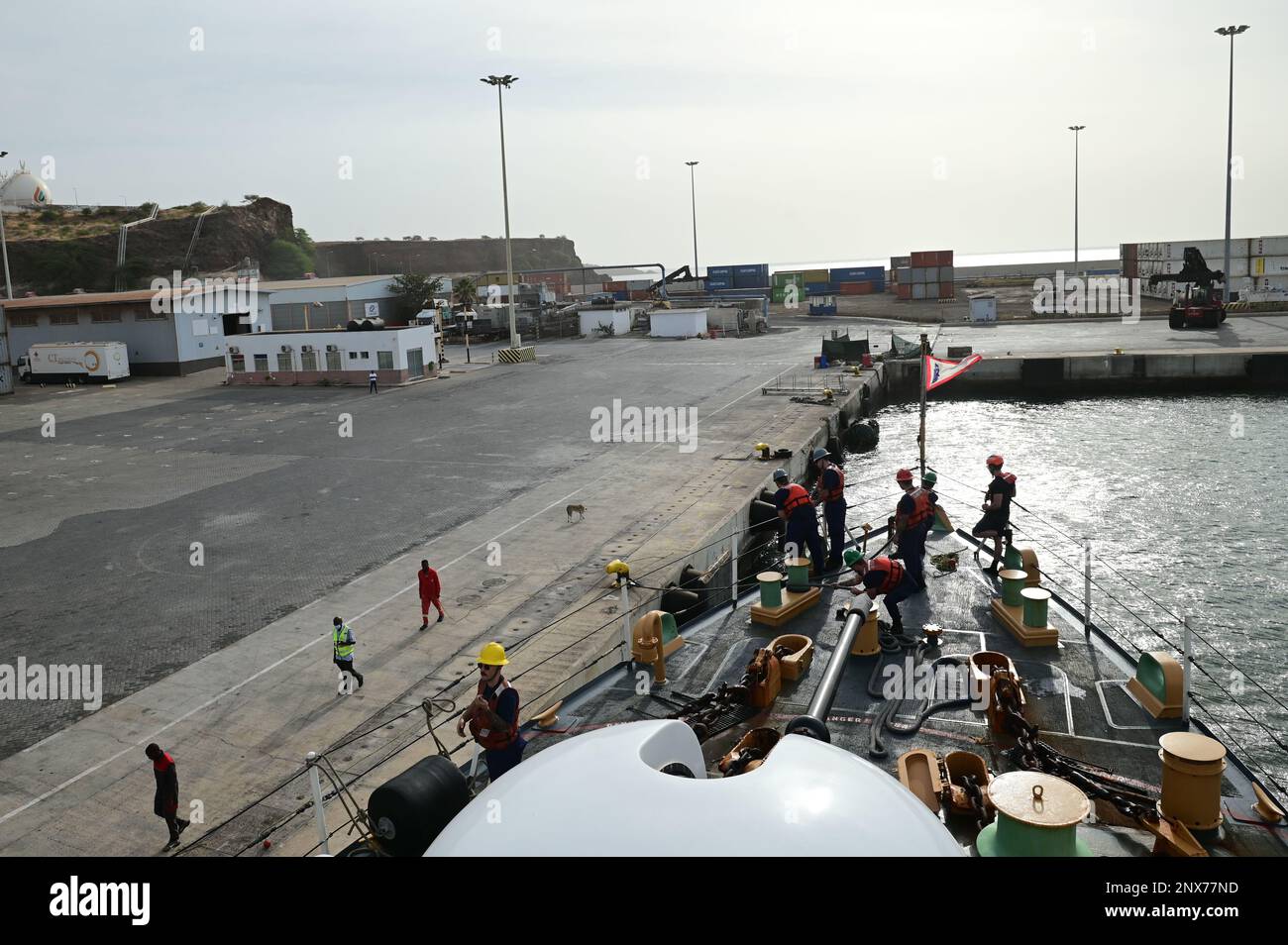 Crew members assigned to USCGC Spencer (WMEC 905), work lines on the ...