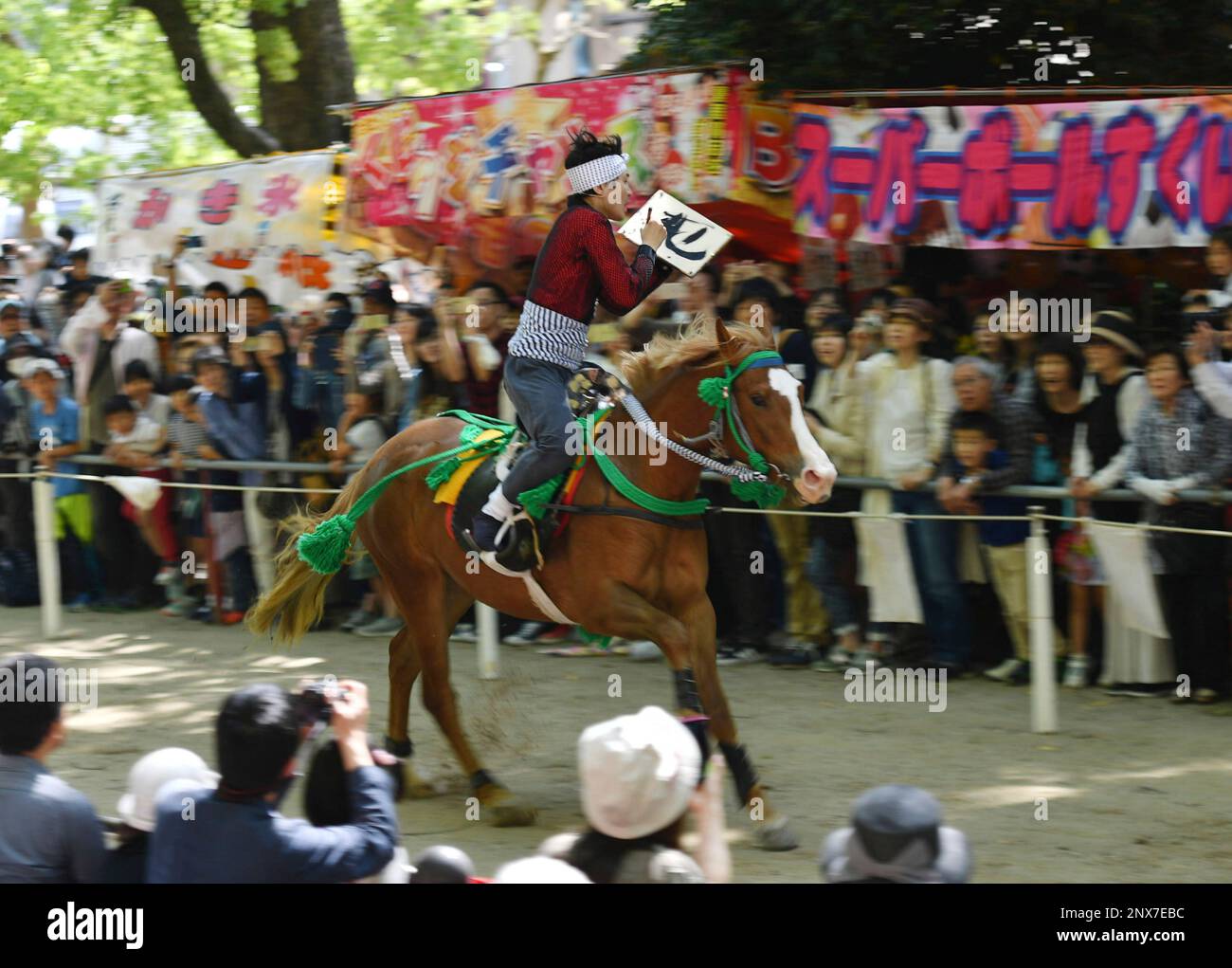 A man performs on a horse running in full speed during Kakeuma Shinji ...
