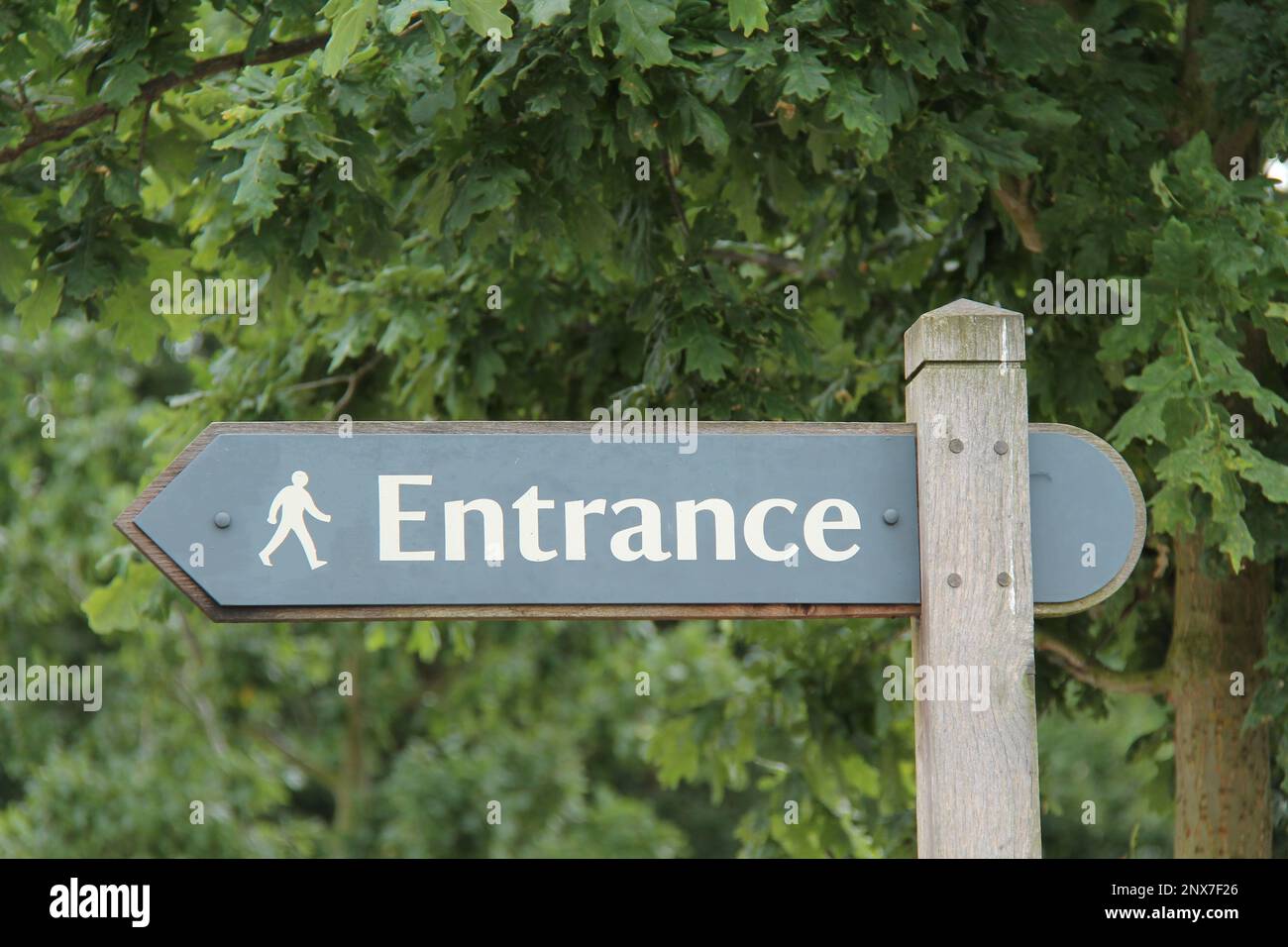 A Sign Post Pointing to a Pedestrian Entrance Stock Photo - Alamy