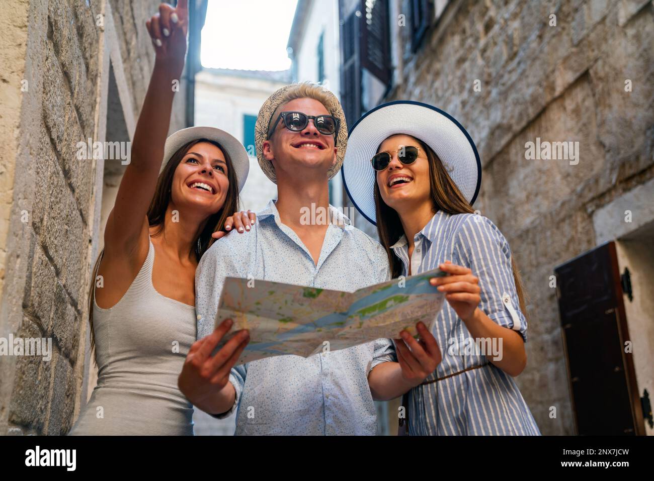 Group of happy friends enjoying travel and summer vacation together ...