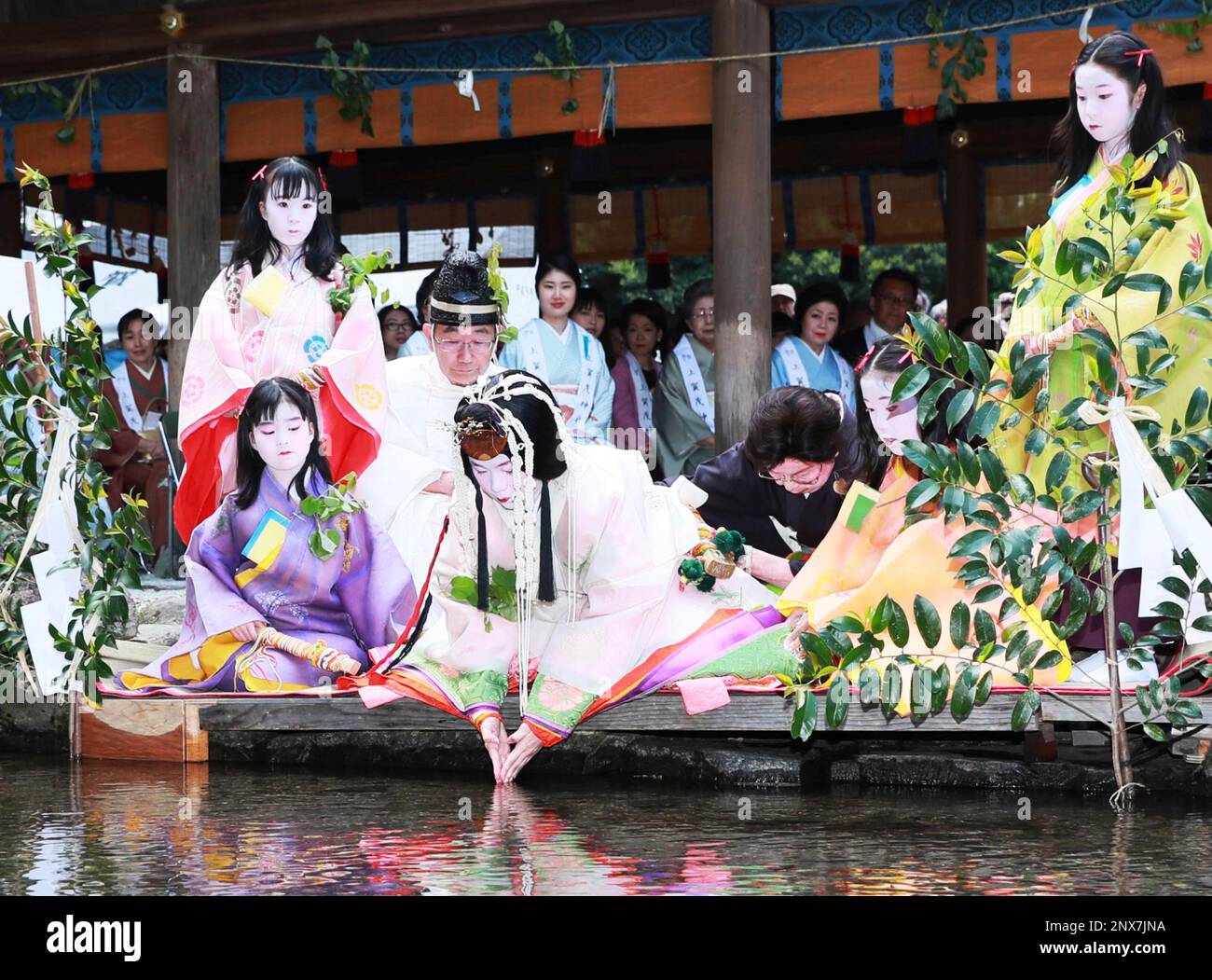 Shiho Sakashita (C) the queen "Saiodai", dressed in traditional multi ...