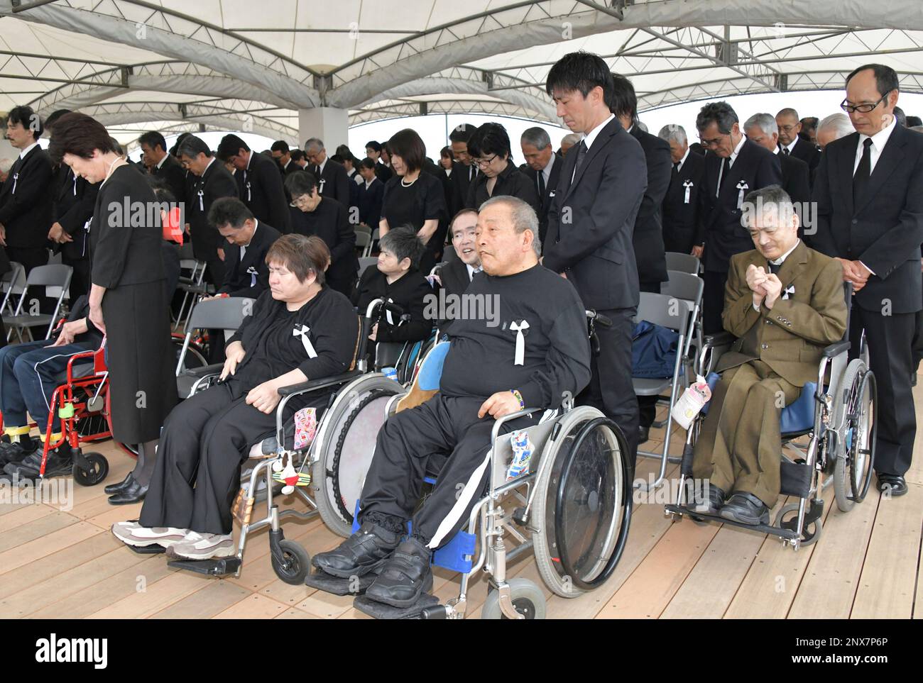 About 700 people including patients offer flowers and pray for the ...
