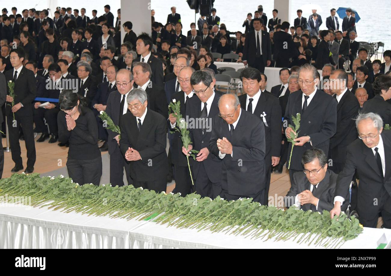 About 700 people including patients offer flowers and pray for the ...