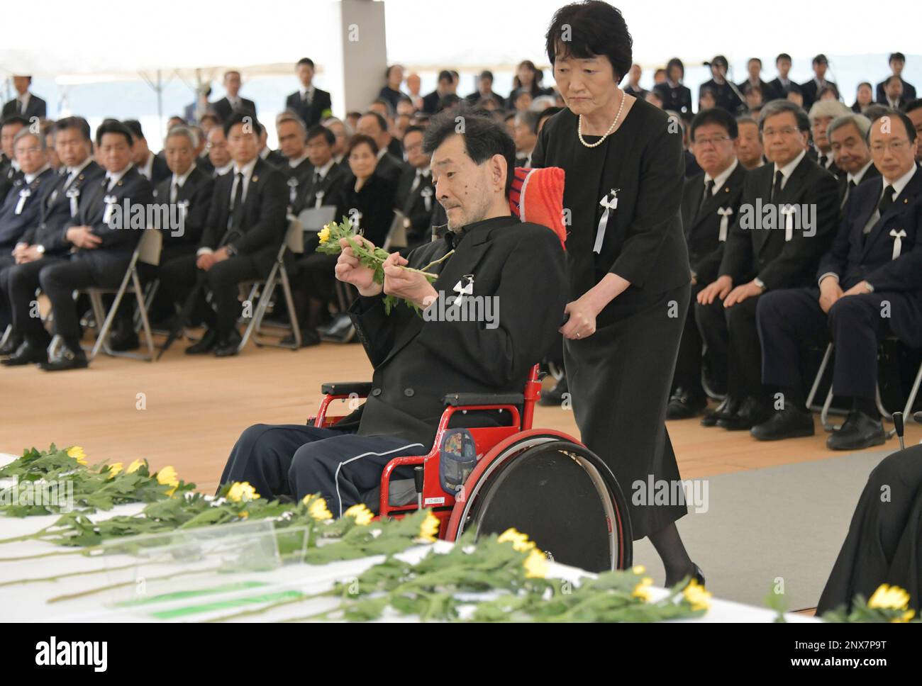 About 700 people including patients offer flowers and pray for the ...