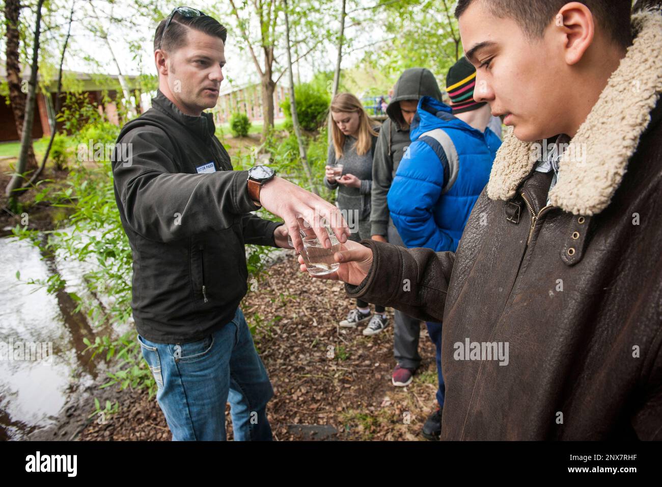 Andrew Bassler with the Tri-State Steelheaders hands a fingerling ...