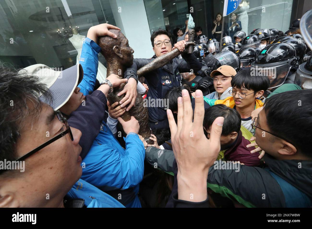 A clash takes place between the riot police official and members of ...