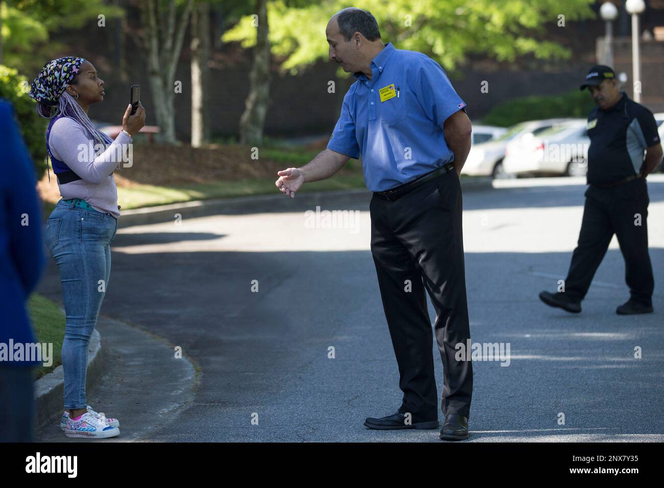 Waffle House Vice President of risk management John Fervier, center ...