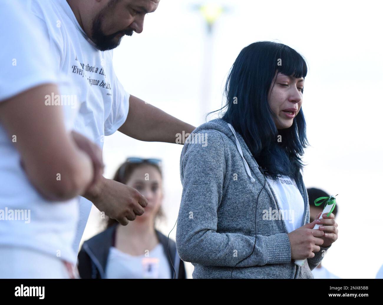 Family and friends gather around the memorial of Alberto Ruiz Wednesday ...