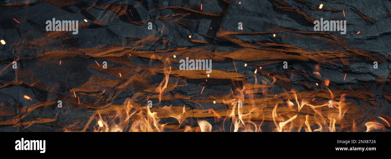 3d rendering of cliff wall illuminated by flames and campfire Stock ...