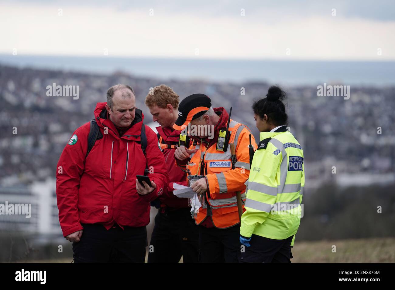 Police officers and officers from London Search and Rescue (LONSAR) at ...