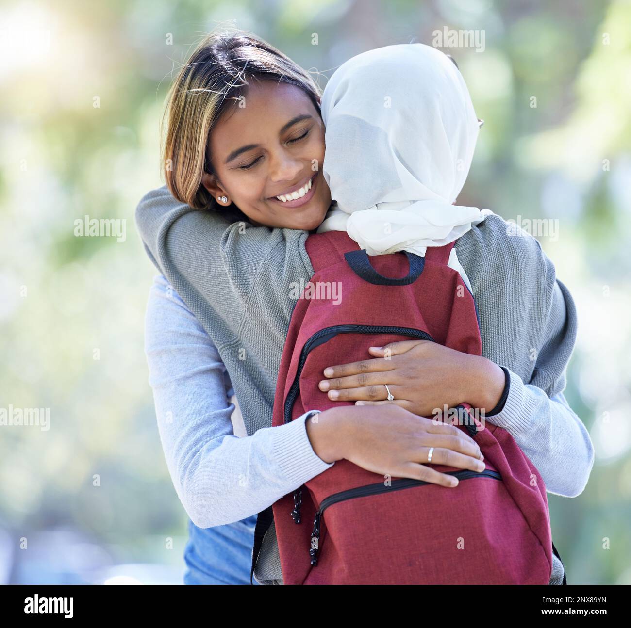Happy muslim students, park or hug with backpack in garden or school ...