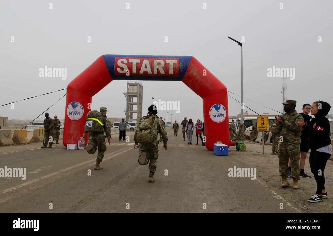 U.S. Soldier cross the finish line during the Danish Contingent March ...