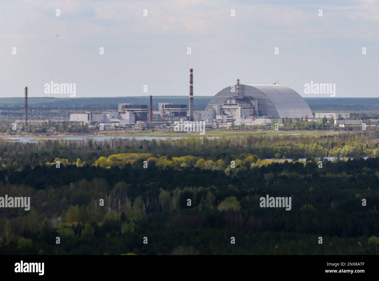 An aerial view of the Chernobyl nuclear power plant and a new shelter ...