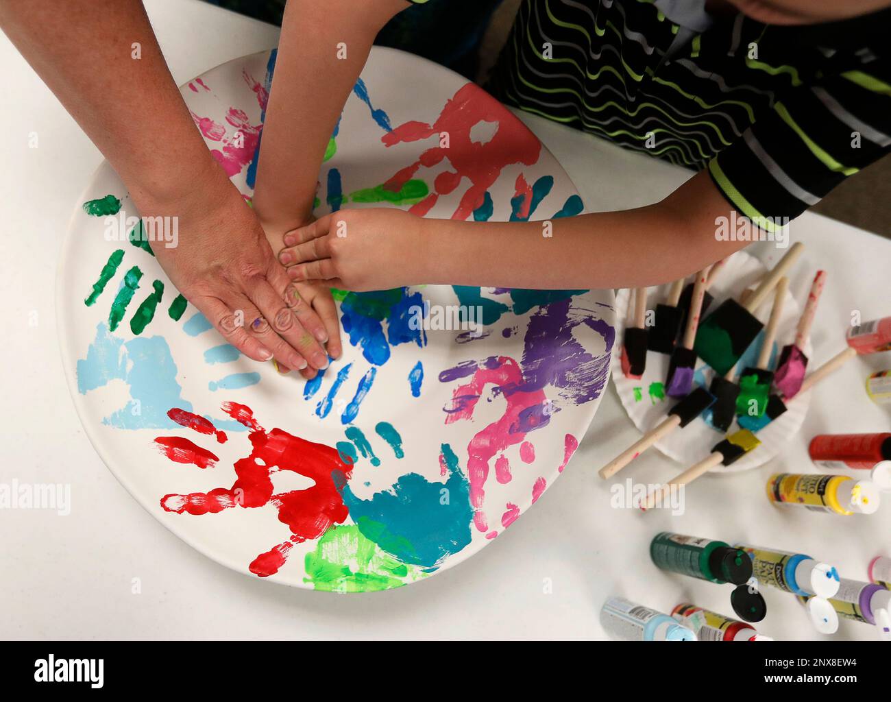 St. John's Epsicopal School teacher Tama Coskrey helps 9-year-old ...