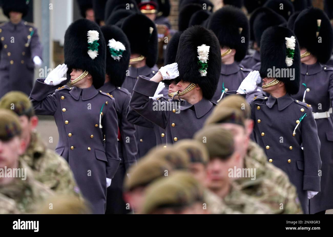 Members of the Welsh Guards salute as they march past the dais during a ...