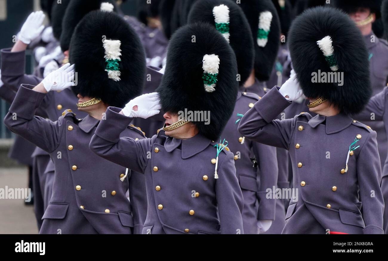 Members of the Welsh Guards salute as they march past the dais during a ...