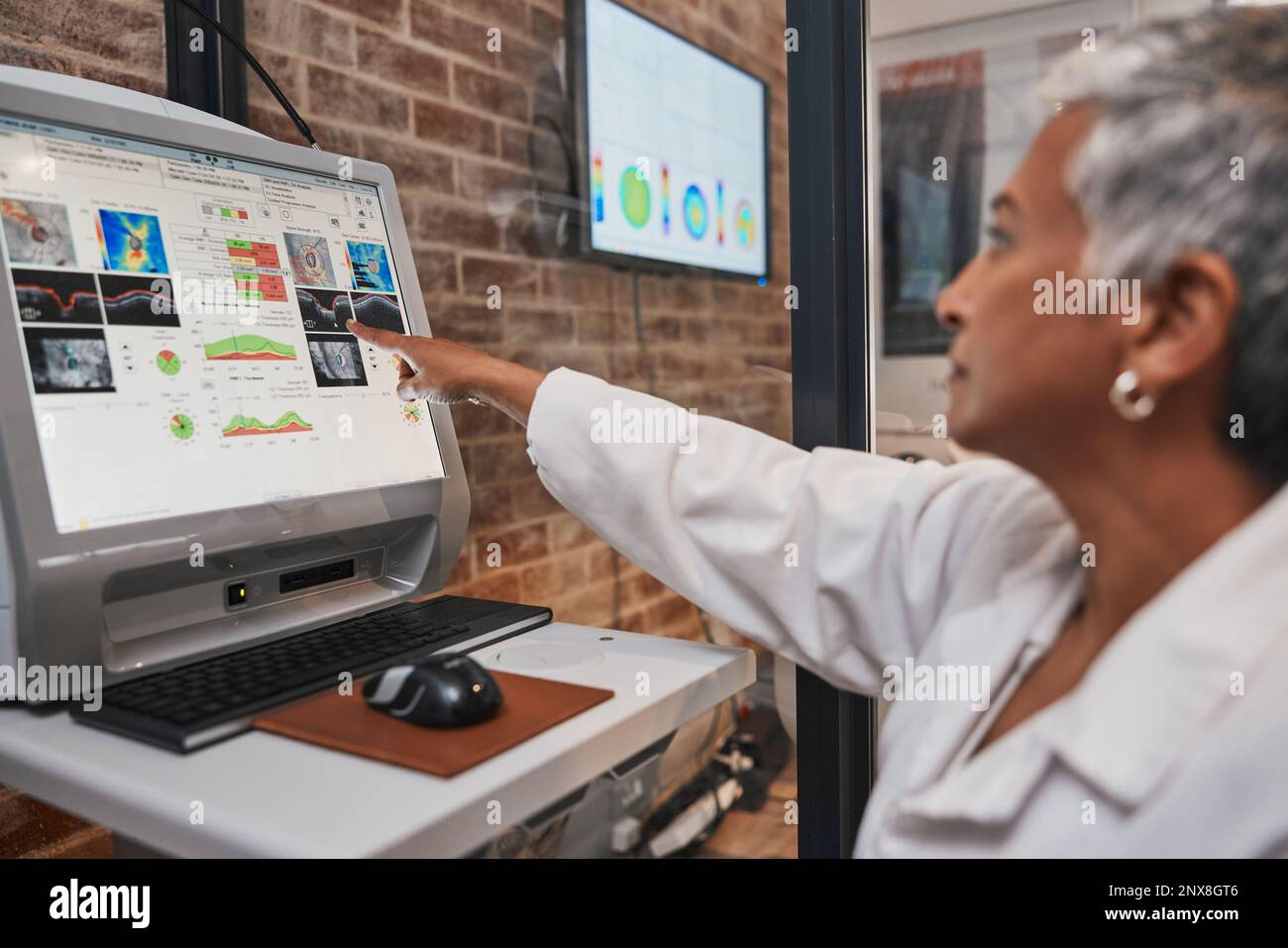Woman optometrist, retina and medical computer for eye analysis ...