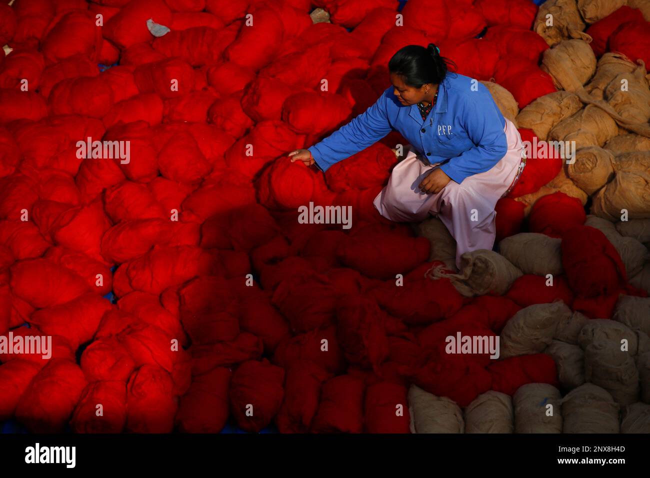 Kathmandu, Nepal. 1st Mar, 2023. A Nepalese woman drying handmade sheep ...