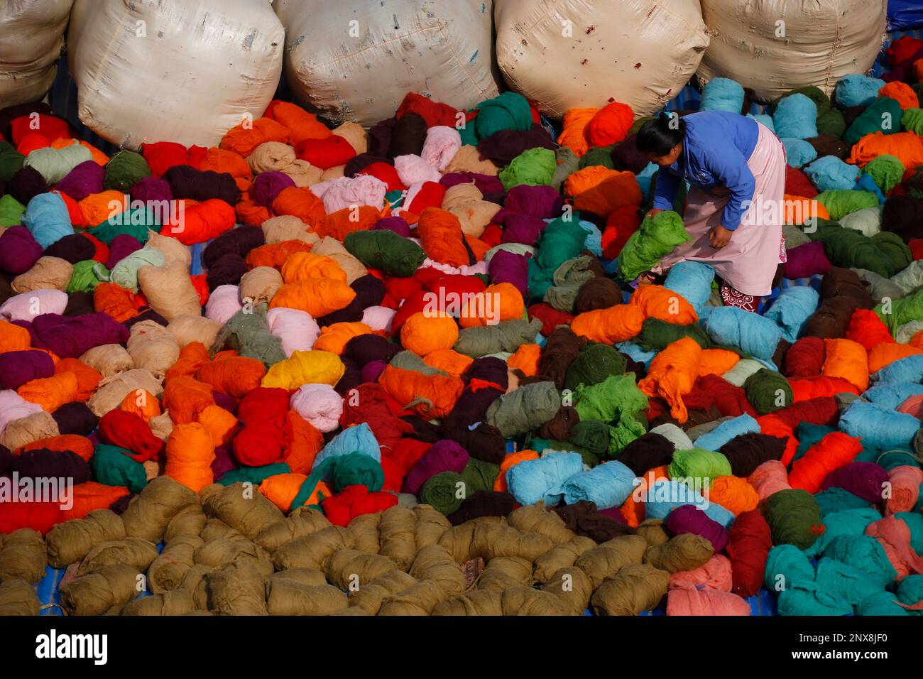 Kathmandu, Nepal. 1st Mar, 2023. A Nepalese woman drying handmade sheep ...