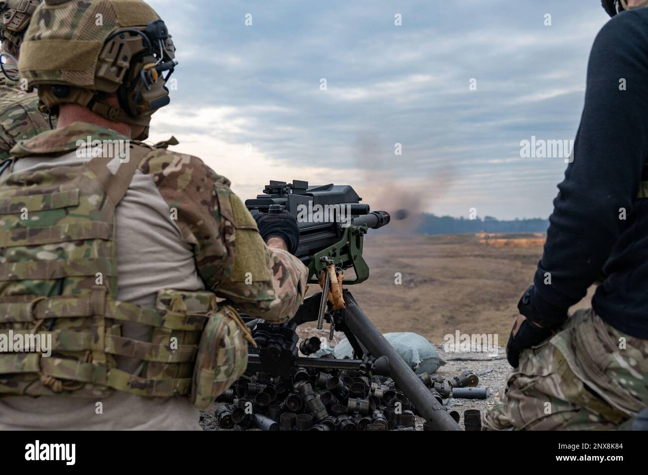 A 304th Rescue Squadron pararescueman fires an Mk 19 grenade launcher ...