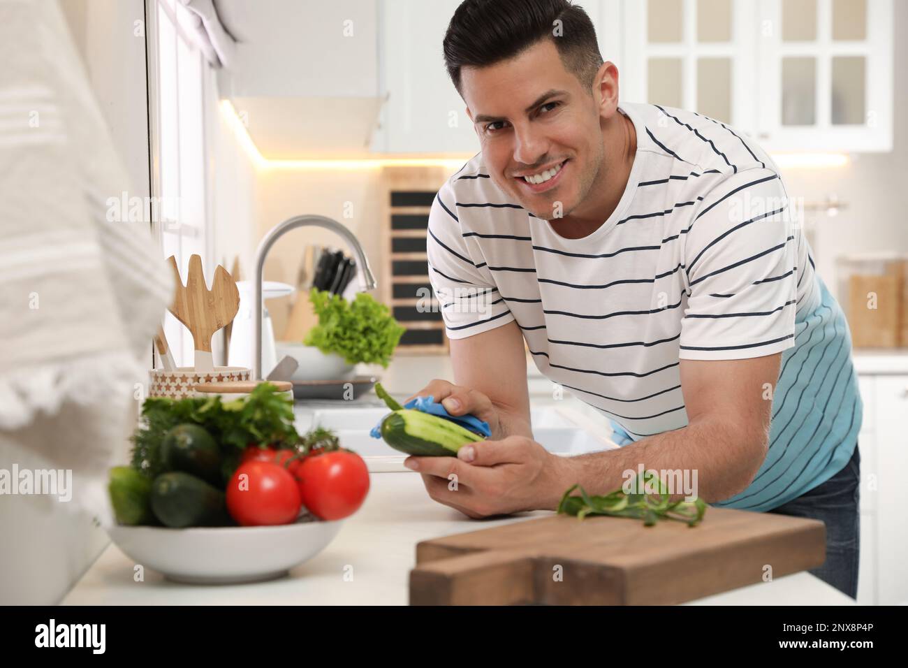 Man peeling cucumber home hi-res stock photography and images - Alamy