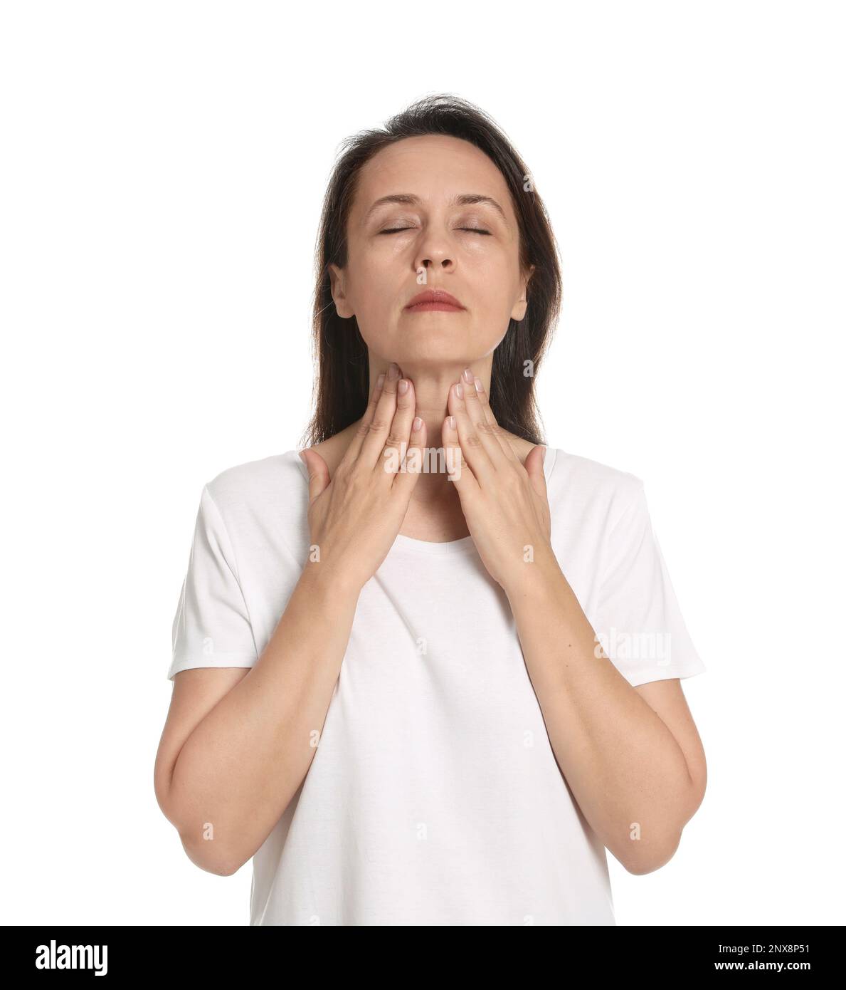 Mature woman doing thyroid self examination on white background Stock ...