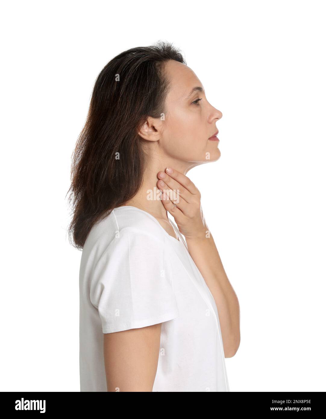 Mature woman doing thyroid self examination on white background Stock ...