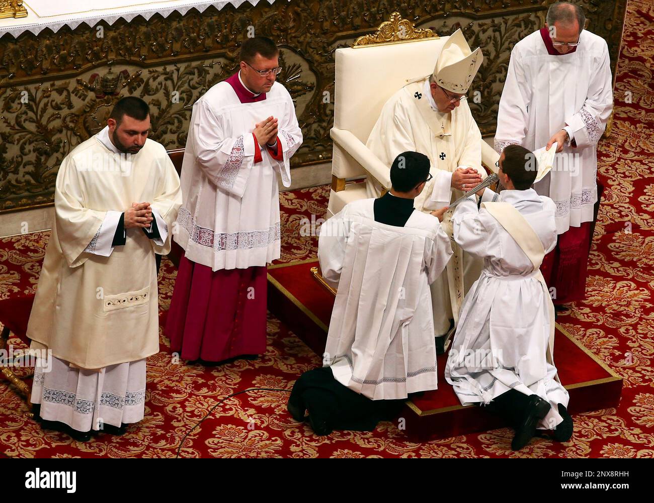 Pope Francis blesses a newly ordained priest during a ceremony in St ...