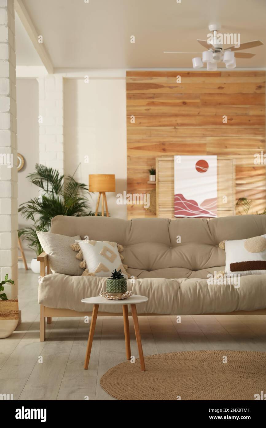 Light room interior with stylish wooden sofa and table. Idea for design ...