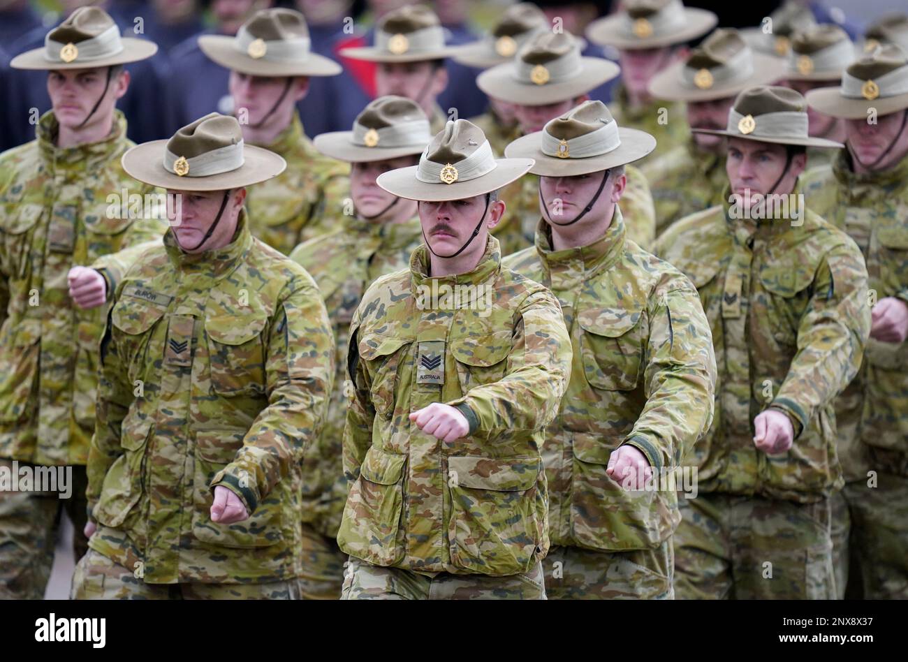 Troops from the 5th Royal Australian Regiment (5RAR) march into the ...
