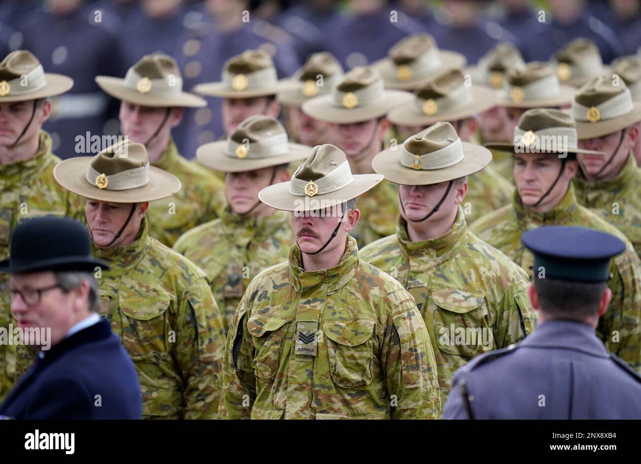 Troops from the 5th Royal Australian Regiment (5RAR) march into the ...