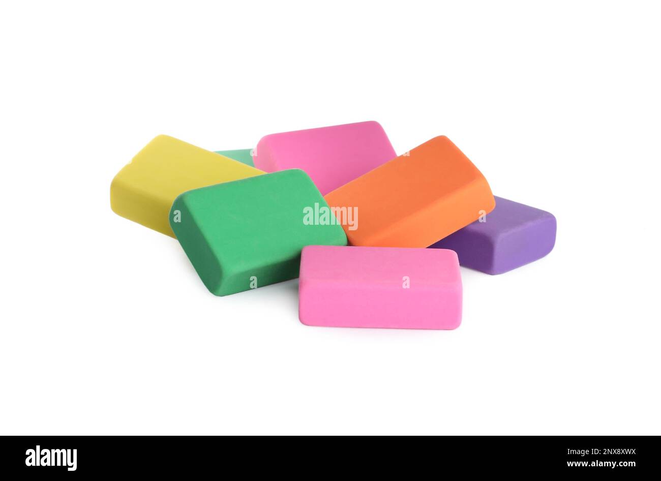 Pile of bright erasers on white background Stock Photo - Alamy
