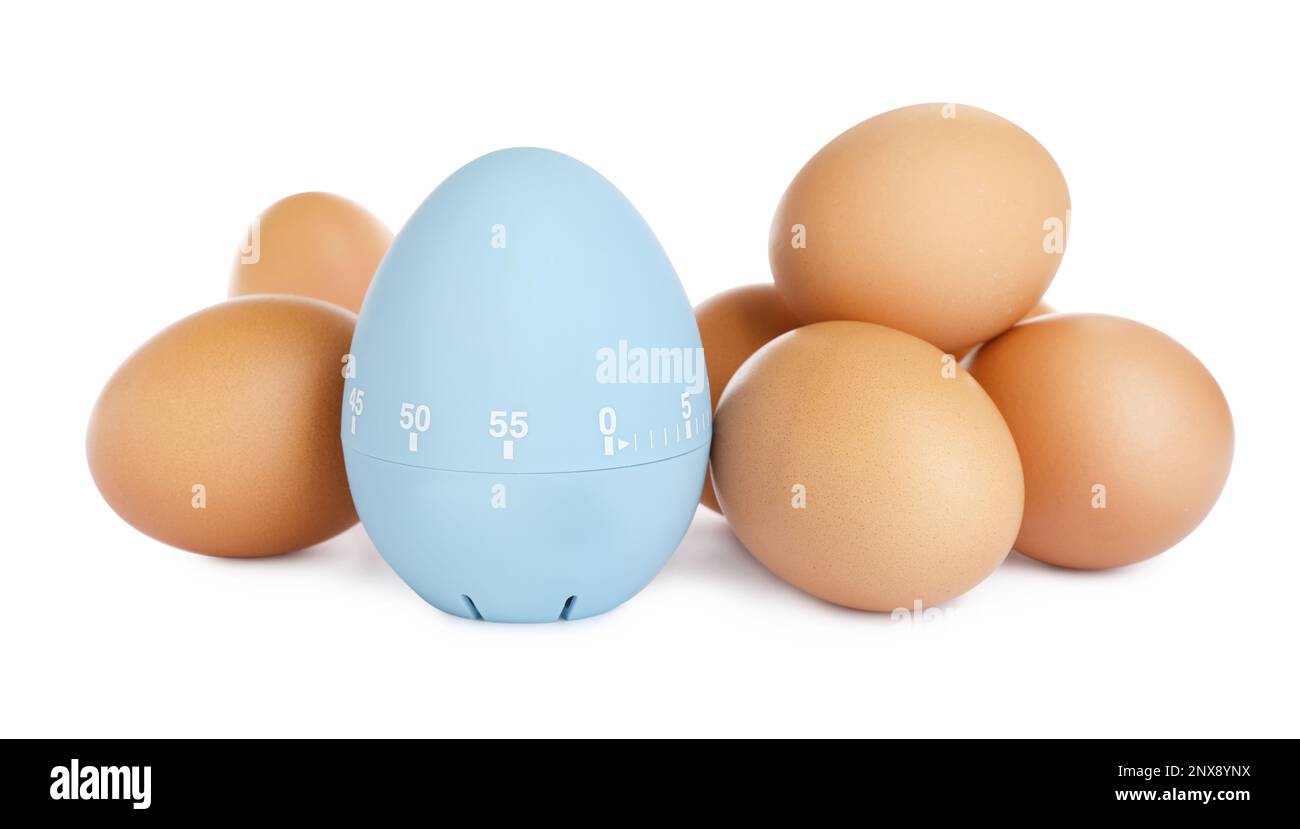 Kitchen timer and chicken eggs on white background Stock Photo - Alamy