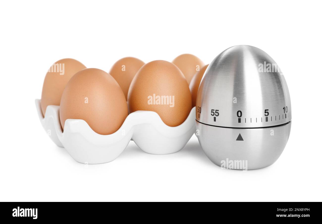 Kitchen timer and chicken eggs on white background Stock Photo - Alamy
