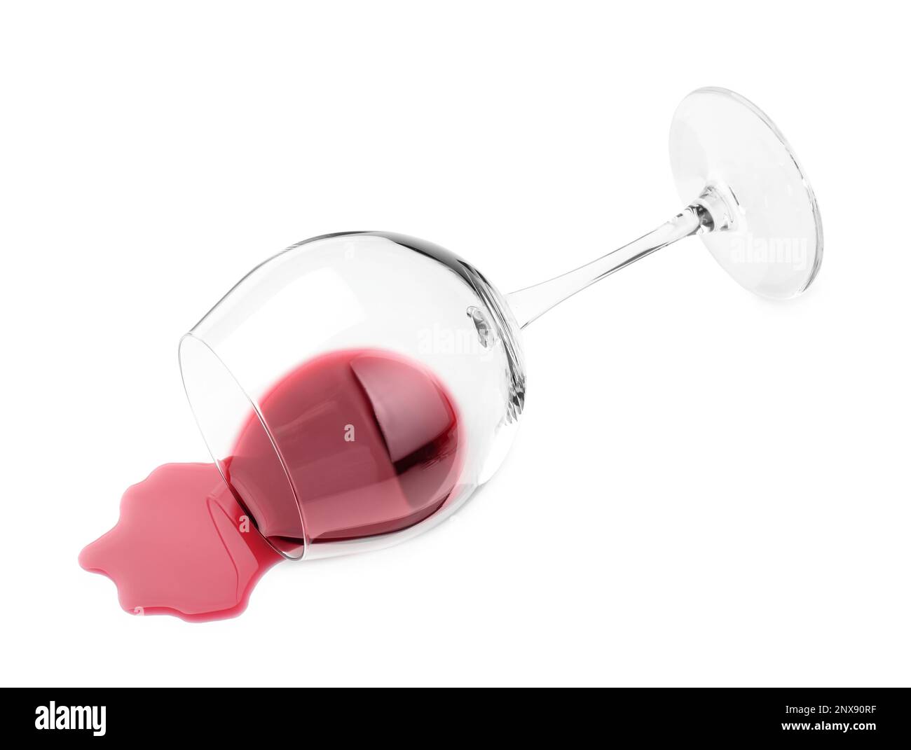Overturned glass and spilled wine on white background Stock Photo - Alamy