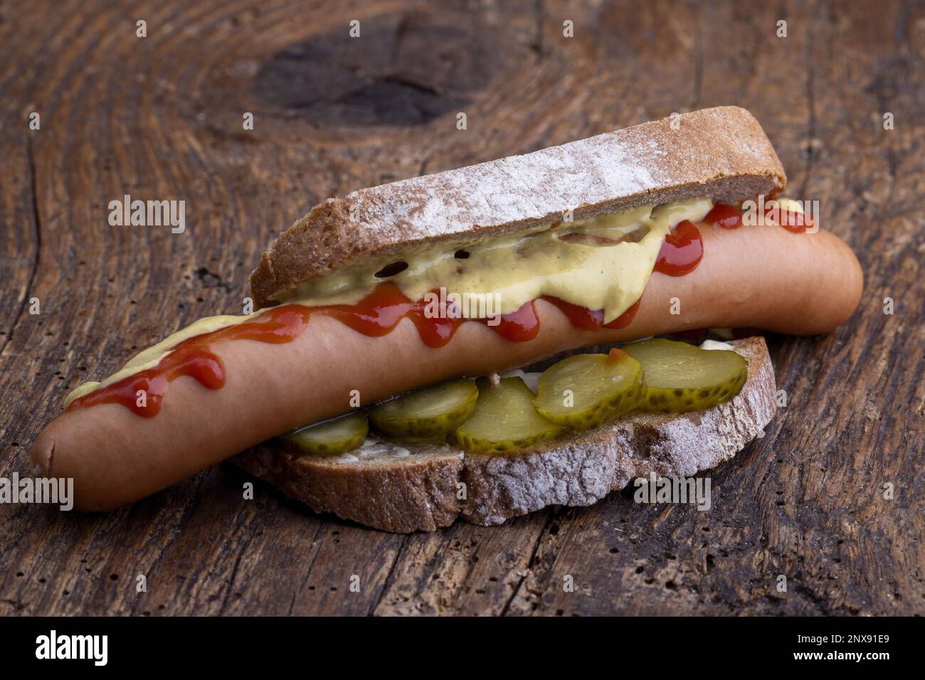 Frankfurter In Bread On Wood Stock Photo - Alamy