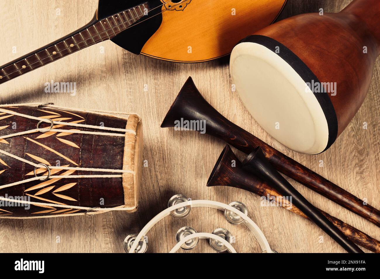 Set of different vintage musical instruments on wooden background, flat ...