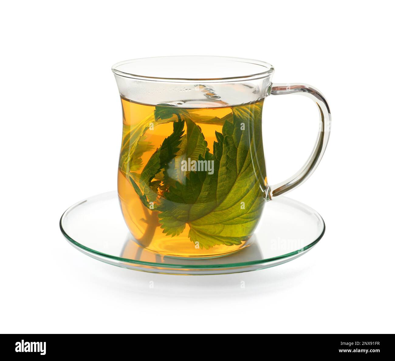 Glass cup of aromatic nettle tea on white background Stock Photo - Alamy
