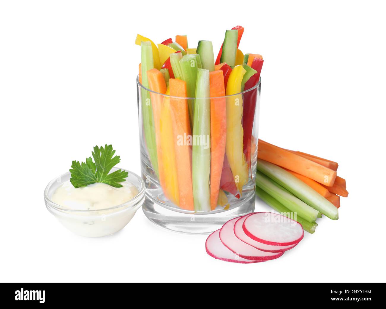 Different vegetables cut in sticks and bowl with dip sauce on white ...