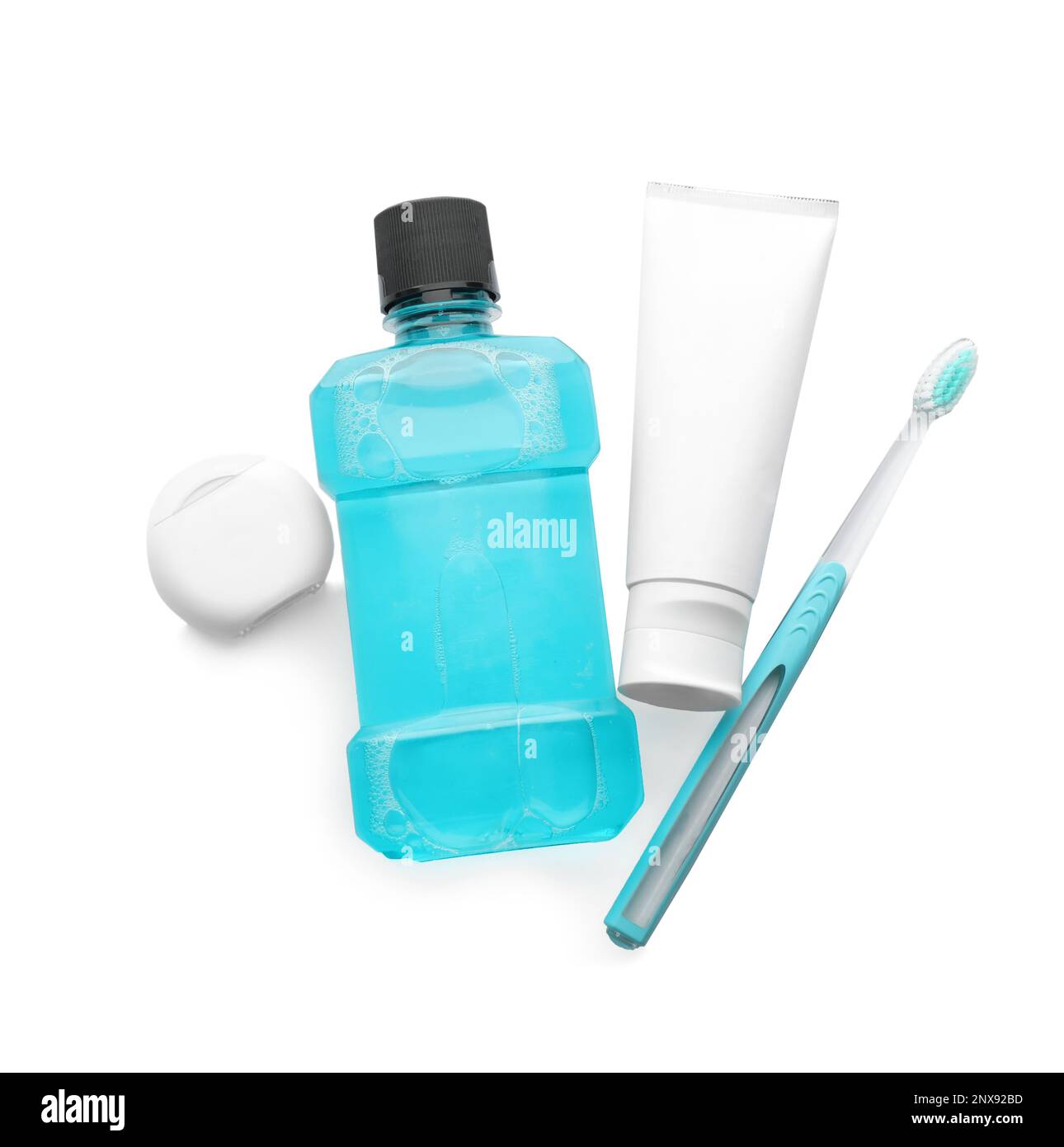 Mouthwash, toothbrush, paste and dental floss on white background, top ...