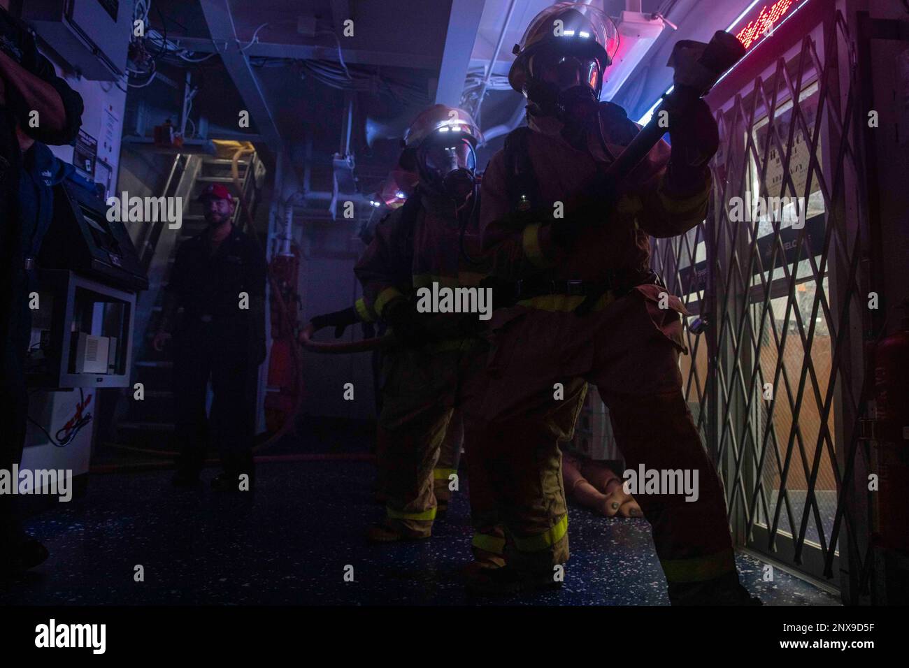 230120-N-XK047-1165 Sailors prepare to attack a simulated fire during a ...