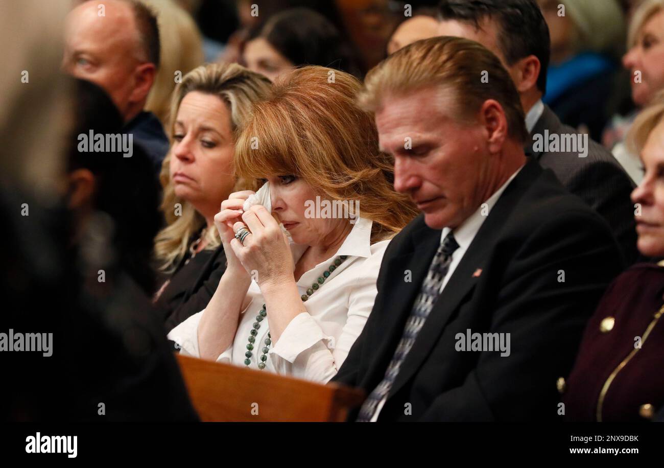 Dani Jo Carter, center, a close friend of Diane McIver, reacts as ...