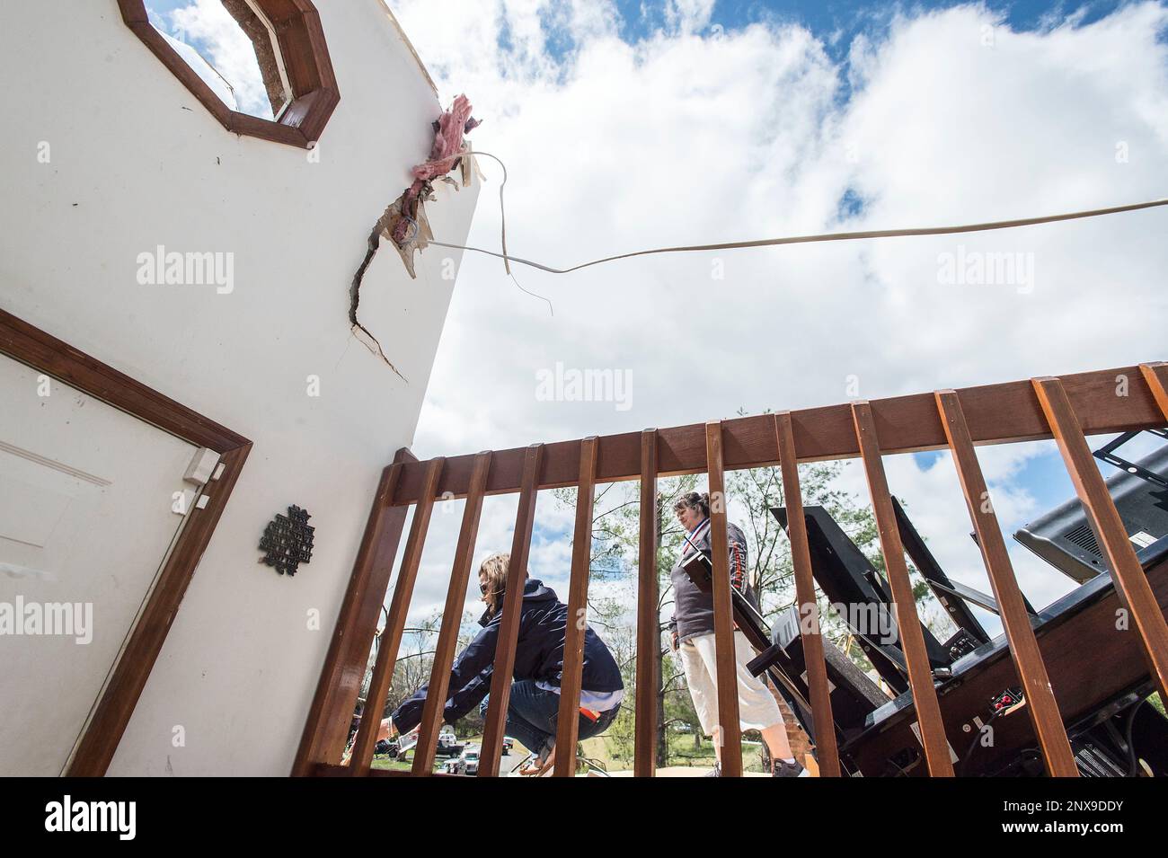 Rebecca Farley and her sister Rene Sellick salvage recoverable items ...