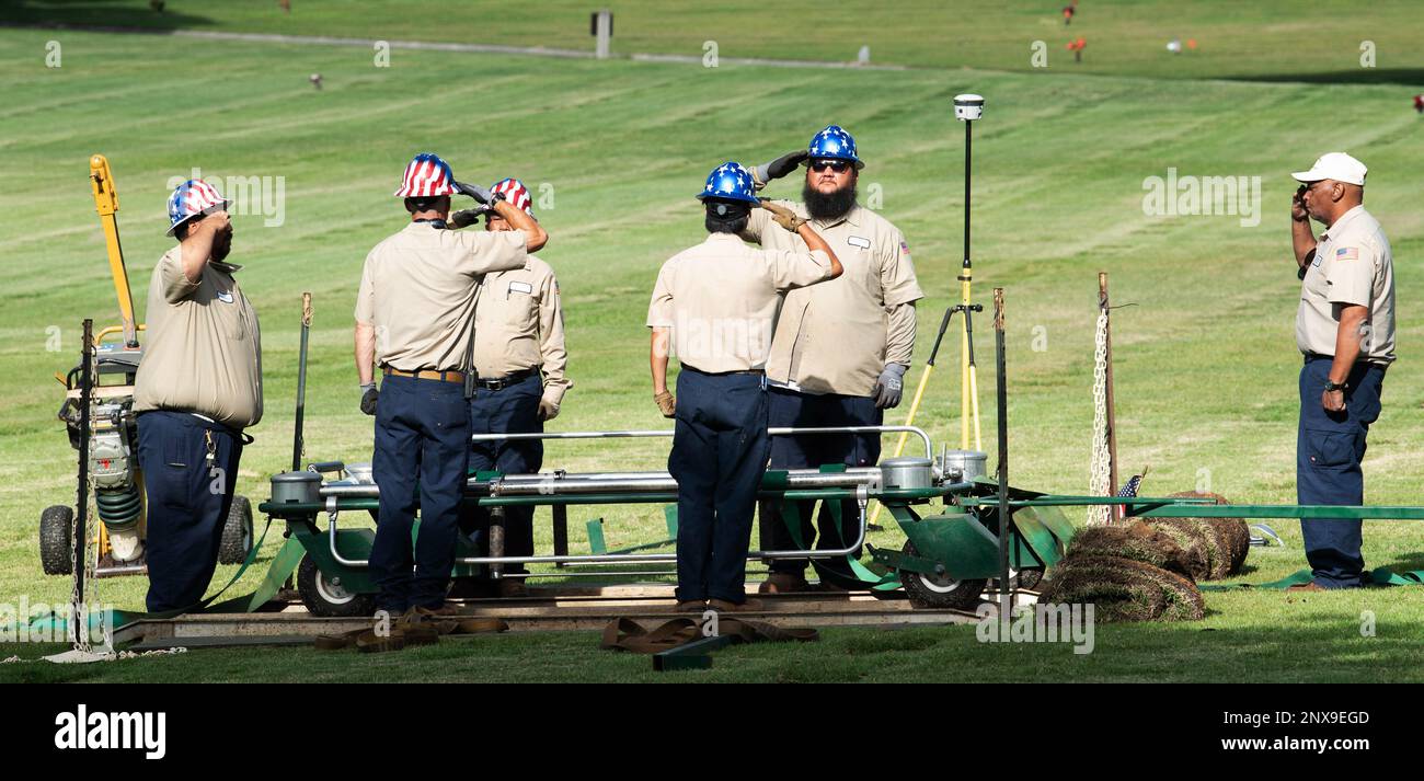Members of the National Memorial Cemetery of the Pacific interment team ...