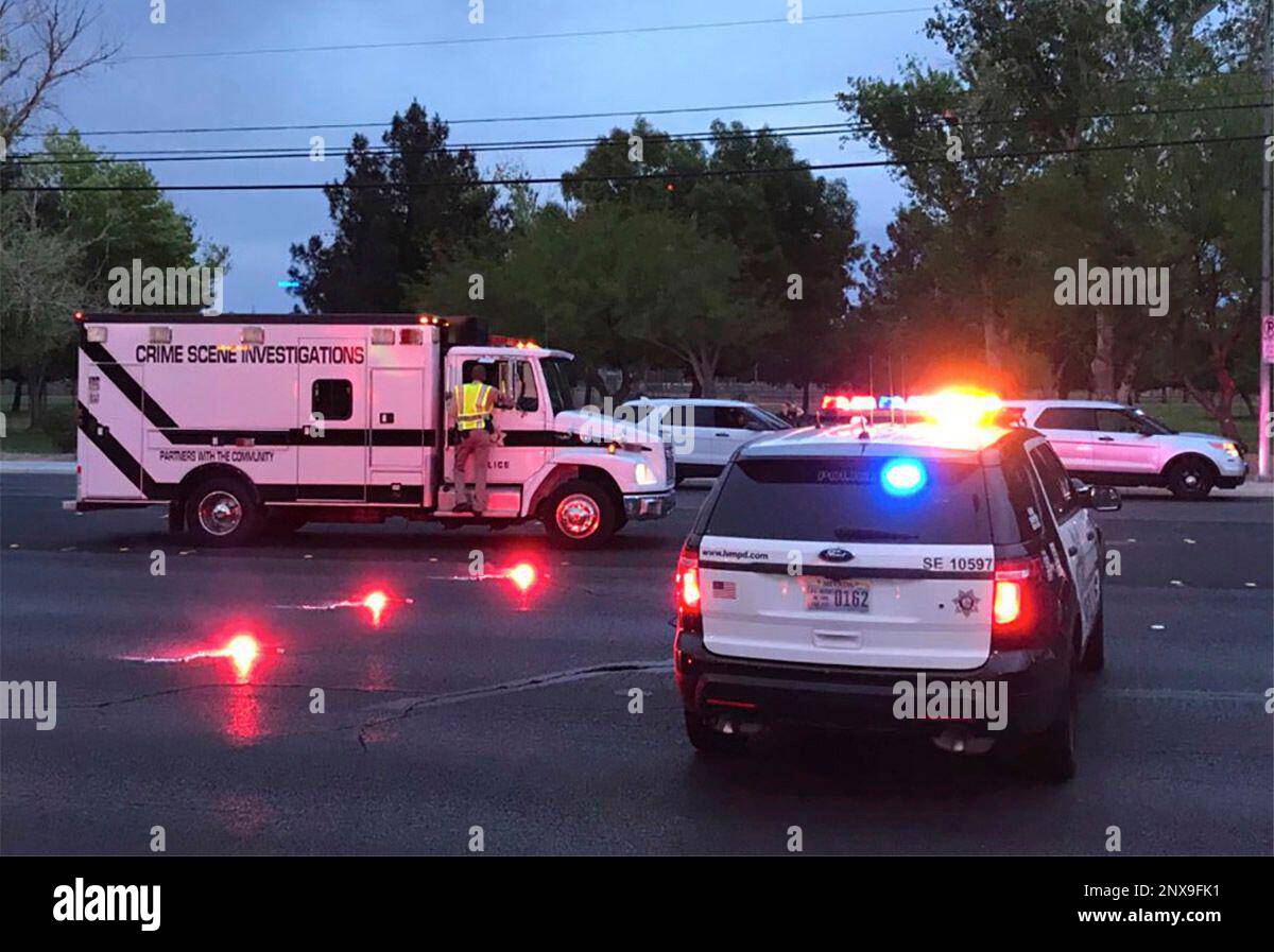 In this Sunday, April 15, 2018 photo, Las Vegas police investigate the ...