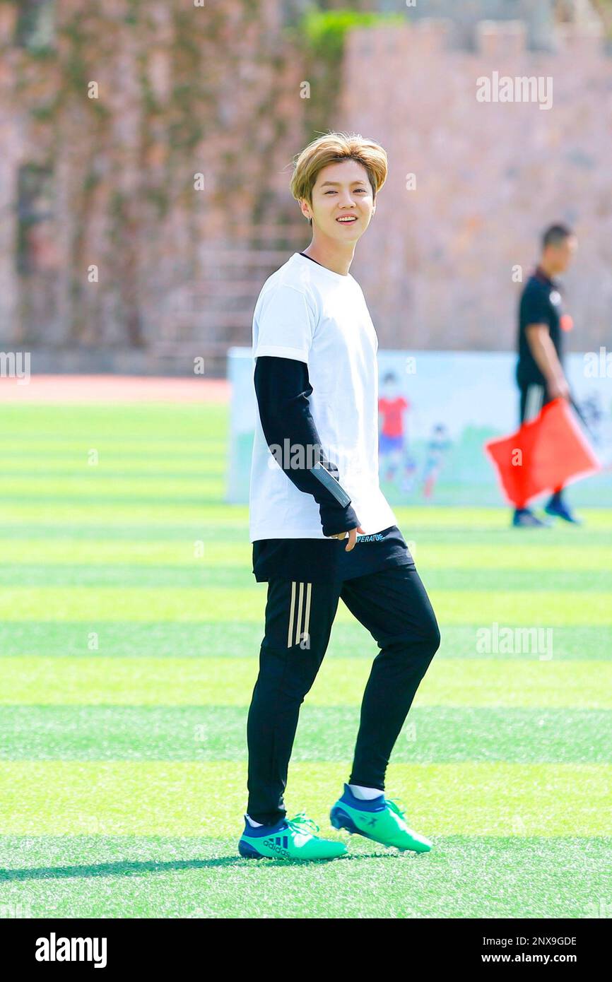 Lu Han attends charity activity "first class of football" in Beijing ...