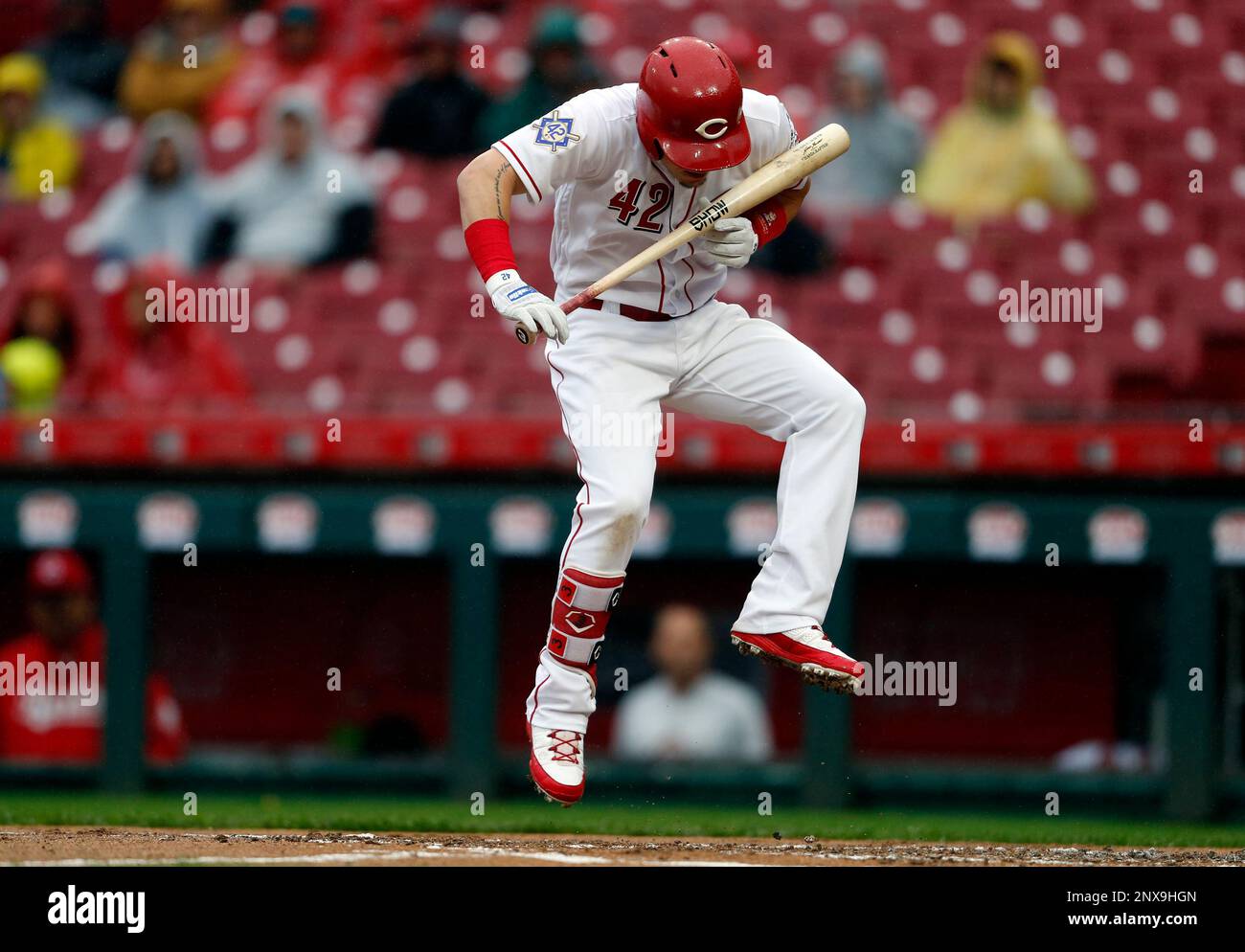 Cincinnati Reds' Scooter Gennett leaps out of the way of an inside ...